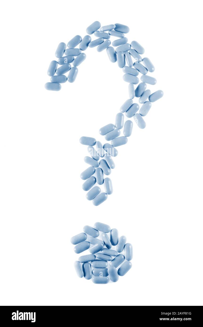 Question mark from pills, isolated on white. In trendy classic blue ...