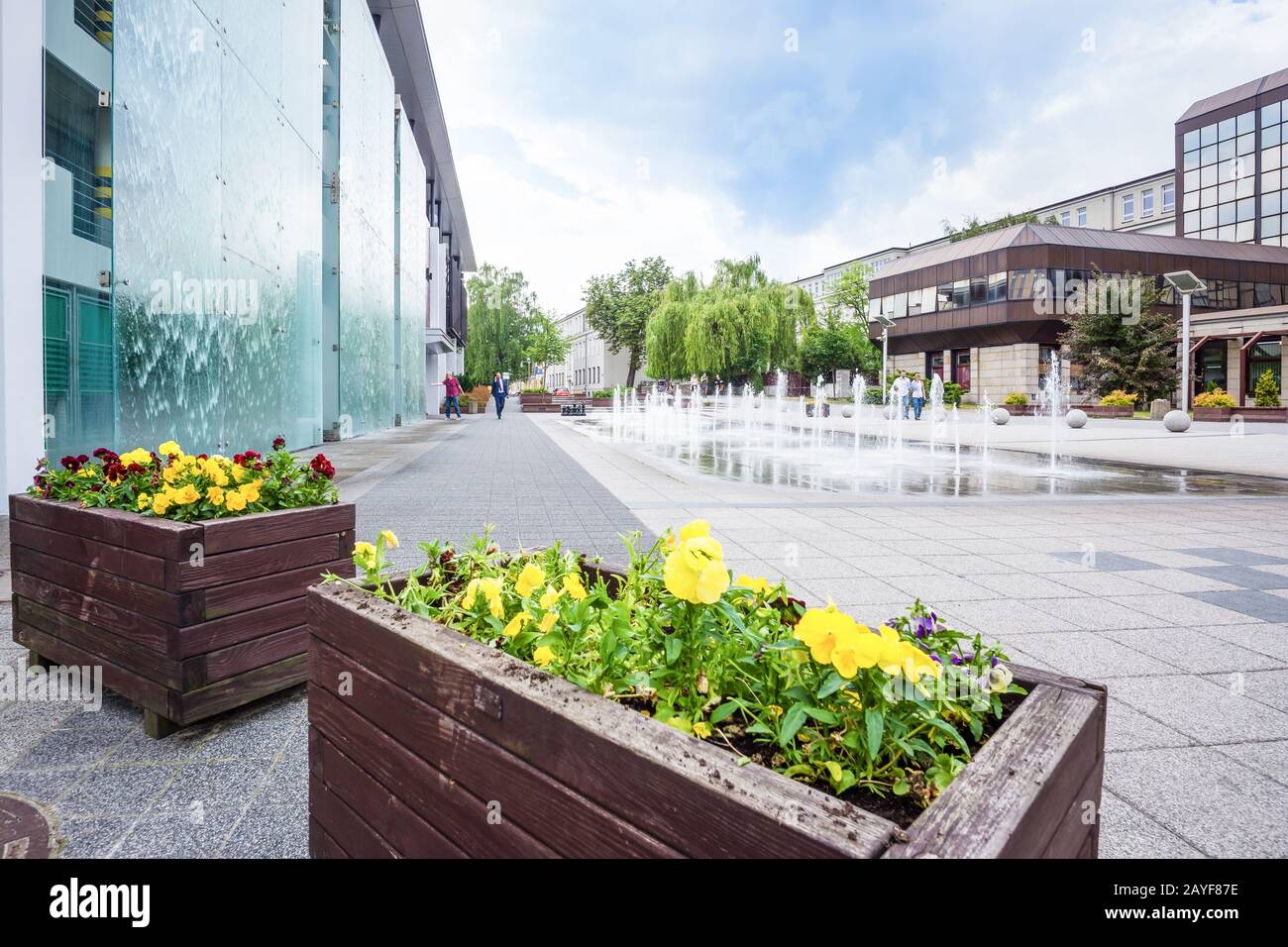 Manmade waterfall from building and ground fountains Stock Photo - Alamy