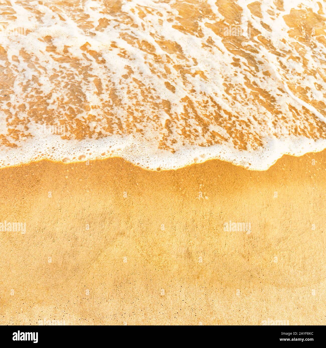 Beach sand and ocean wave Stock Photo - Alamy