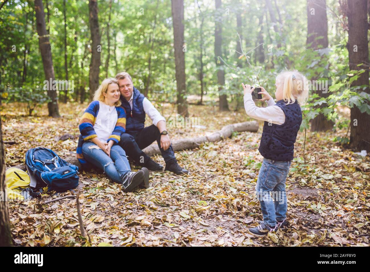 travel, tourism, hike, technology and family concept. Happy child makes ...