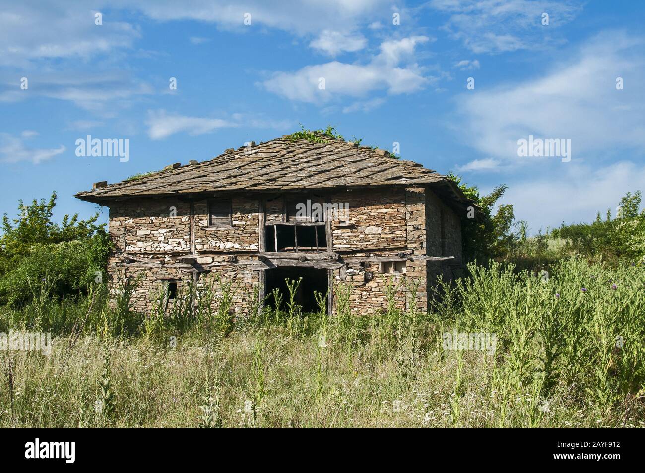 Old rural country stone house facade in sunny summer day Stock Photo ...