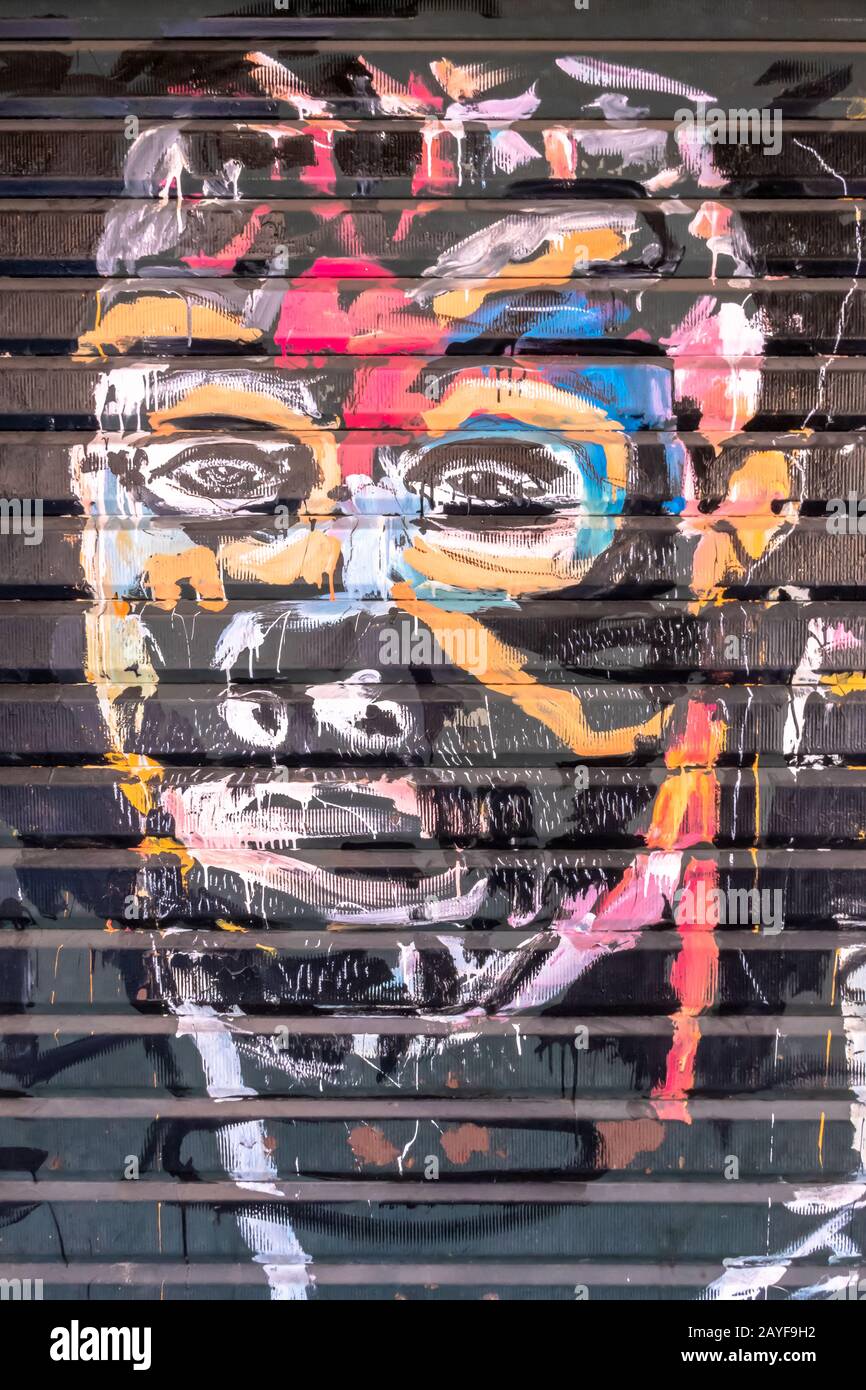 Colorful human face on graffiti artwork Stock Photo - Alamy