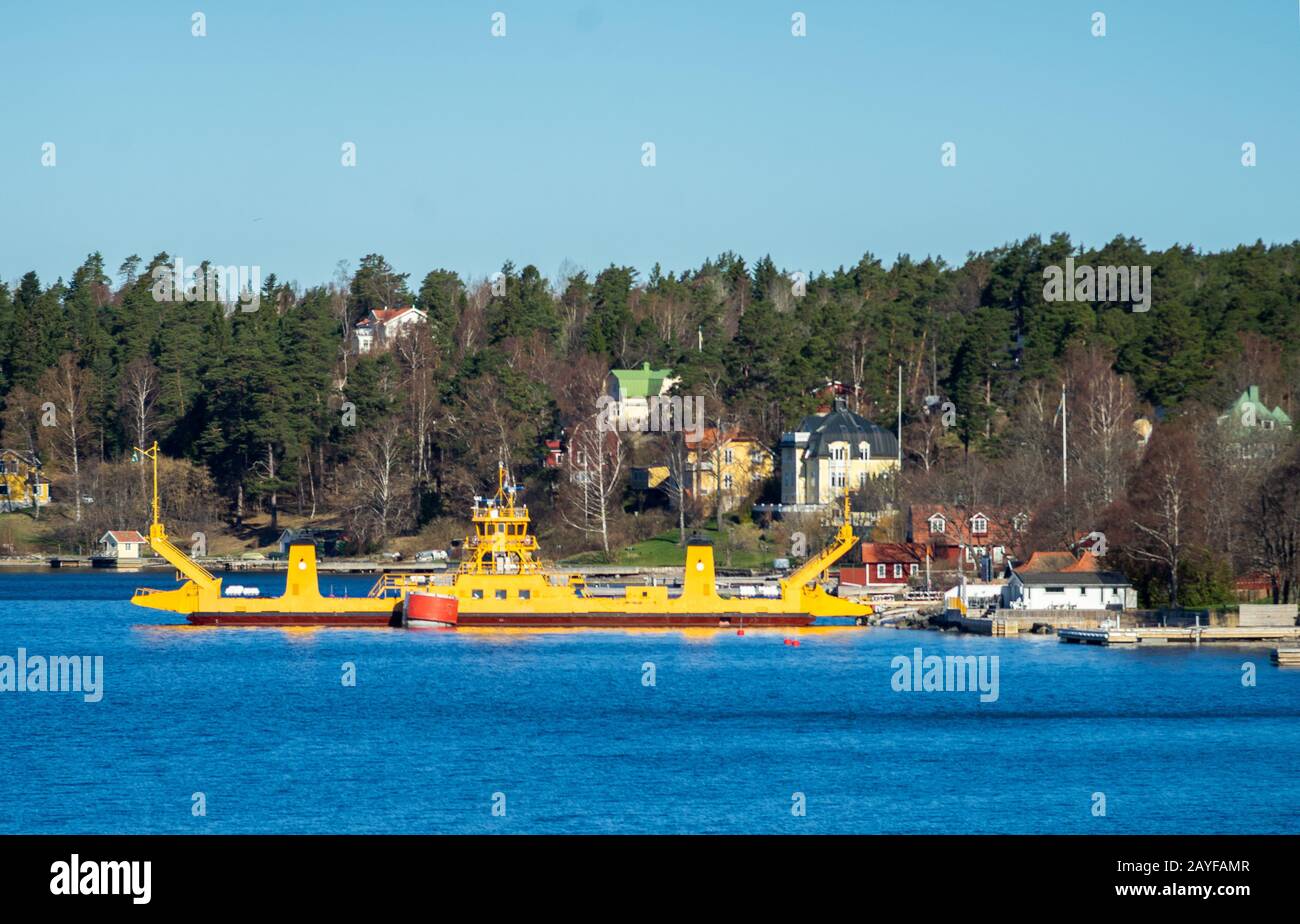 Yellow ferry for transporting cars and people from the islands of the ...