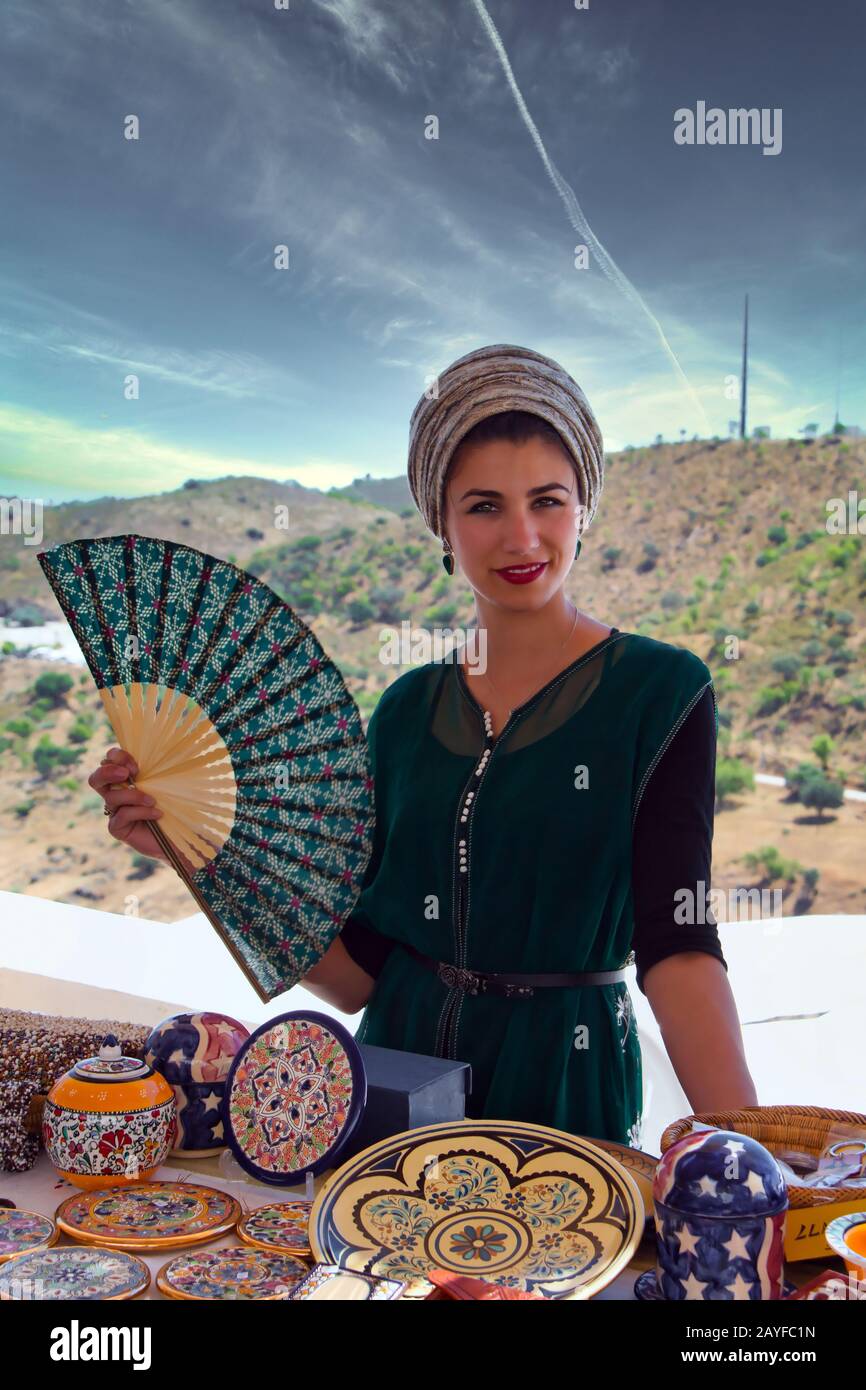 Mertola, Beja, Portugal - May 20, 2017: A pretty girl selling ...