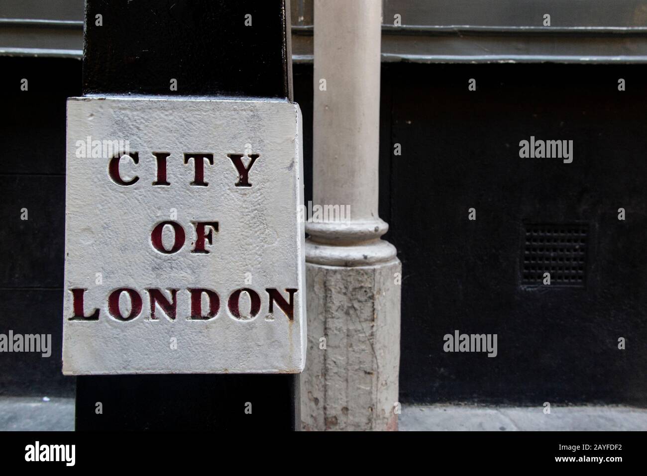An old fashioned sign on a bollard with City of London inscribed Stock ...