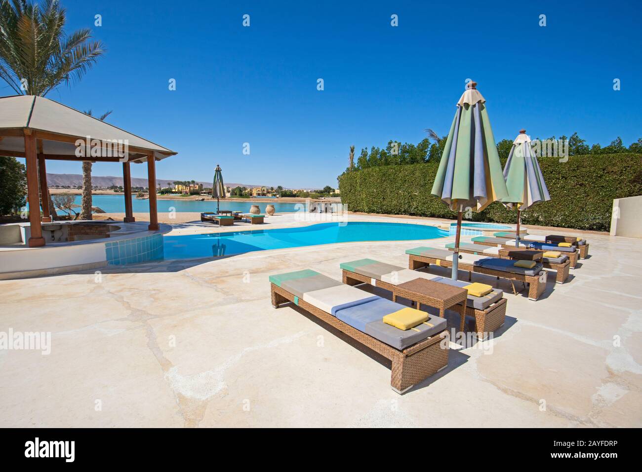 Luxury villa show home in tropical summer holiday resort with swimming ...