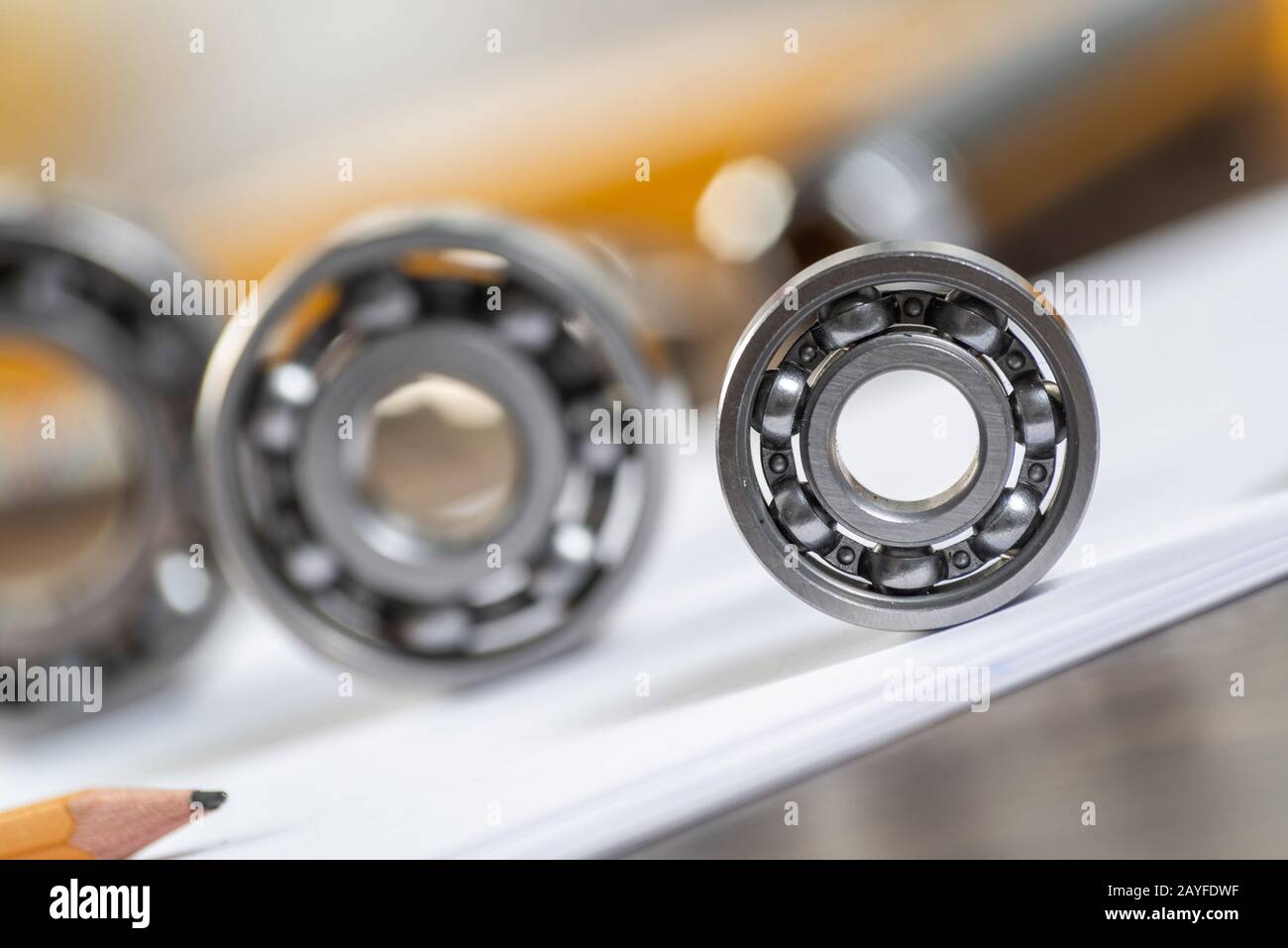 Three various ball bearings lying on paper sheet Stock Photo - Alamy