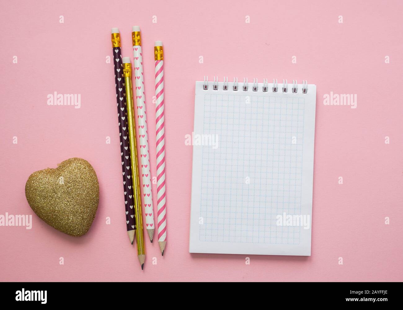 Notebook blank empty white sheet of paper with crayons on the table ...