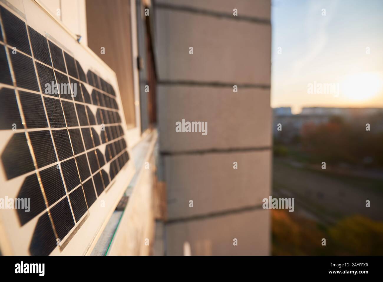 Solar panel on the window of a high-rise residential building against a ...