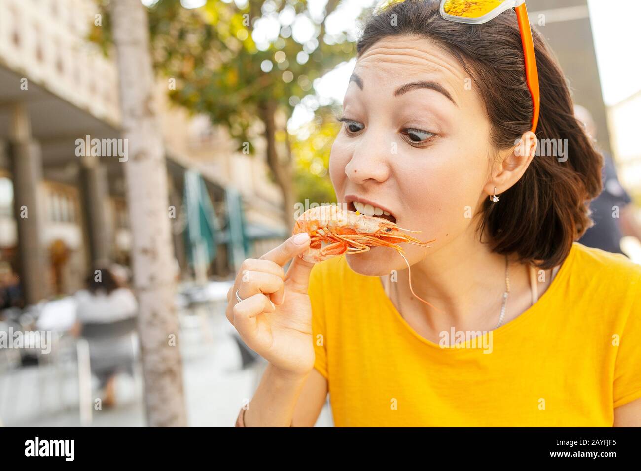 Asian women eating delicious prawn, seafood and shrimp concept Stock ...