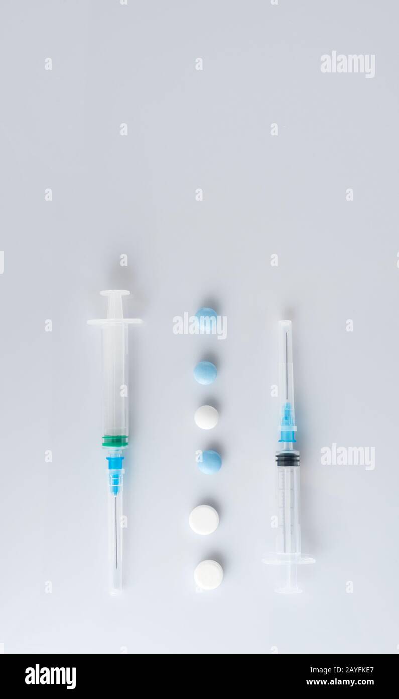 Various medicine tablets and syringes. Health care concept. Close-up ...