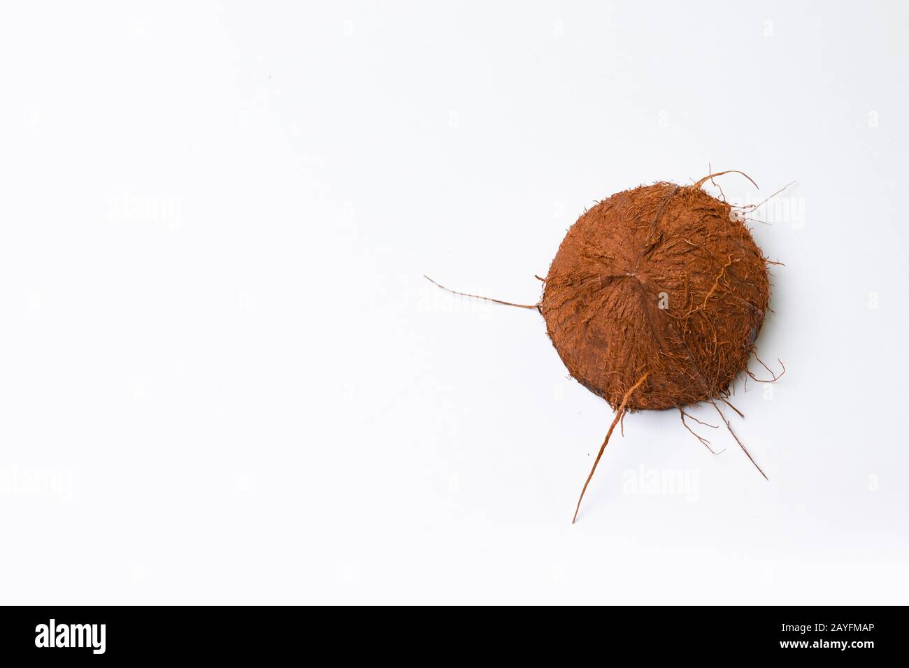 Half coconut on a grey background with place for text, flat lay Stock ...