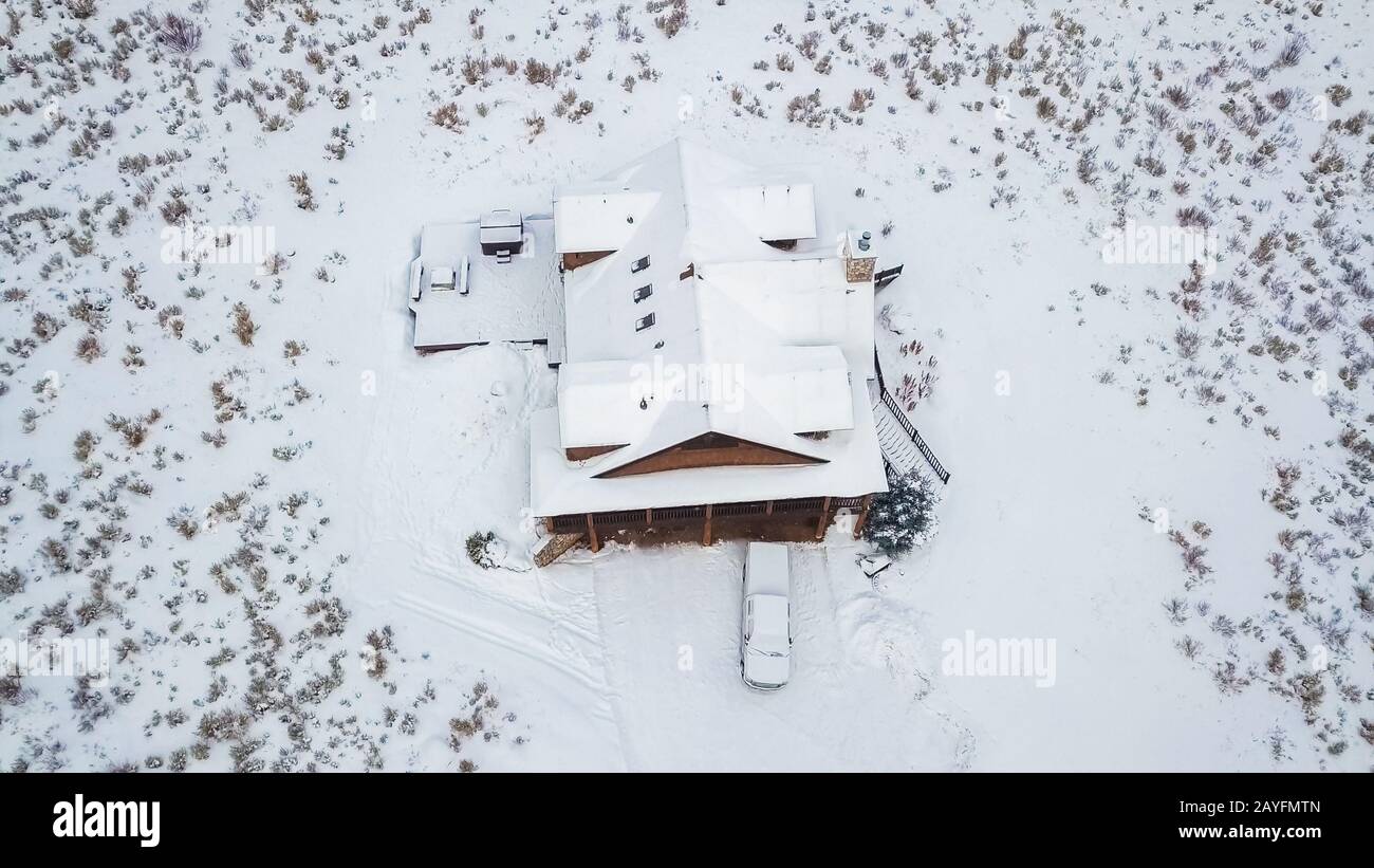 Aerial view of the mountain house covered in snow in the Winter Stock ...