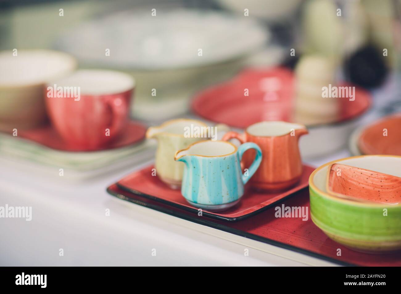 Designer handmade dishes, plates and cups in a stylish boutique Stock ...