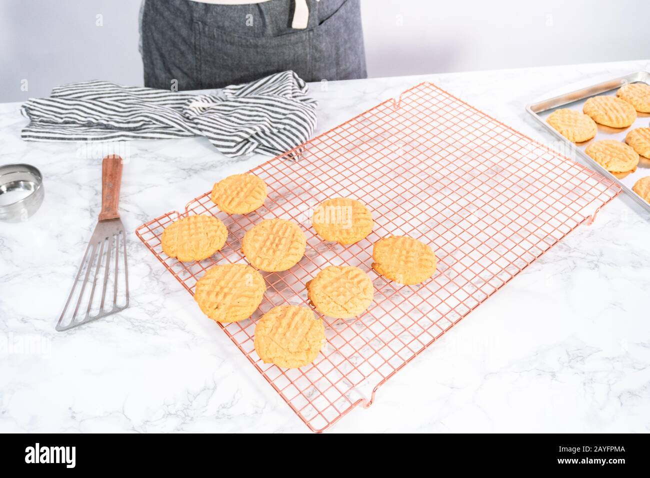 Freshly baked peanut butter cookies cooling on a drying rack Stock ...