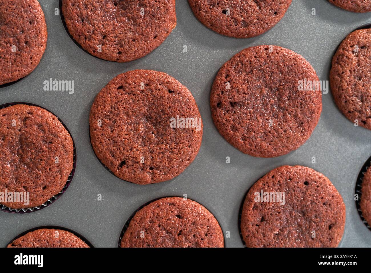 Cooling freshly baked red velvet cupcakes Stock Photo - Alamy
