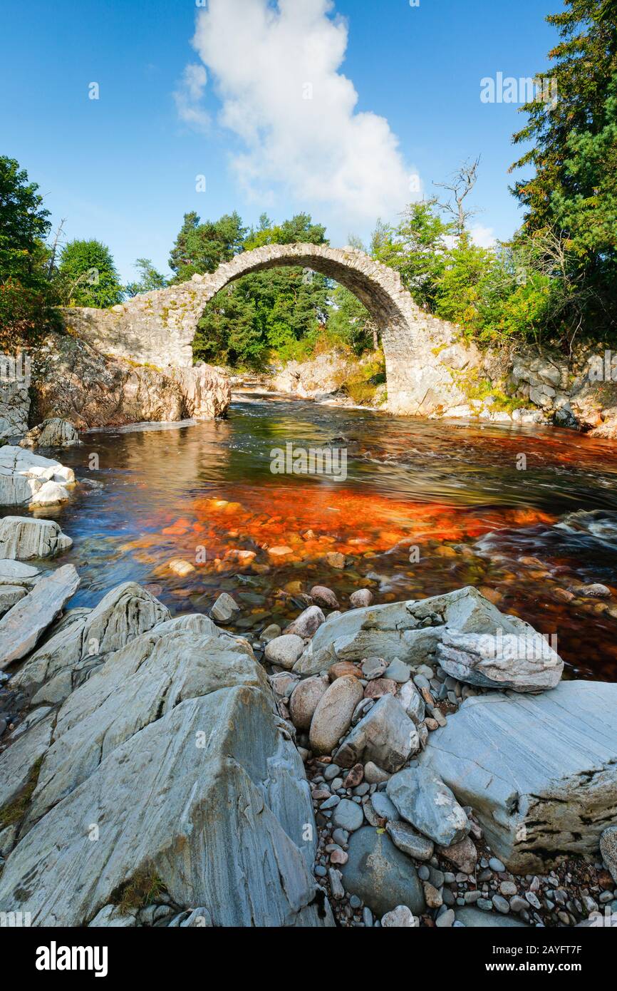 Dulnain river with Carrbridge, the oldest stone bridge in the Highlands ...