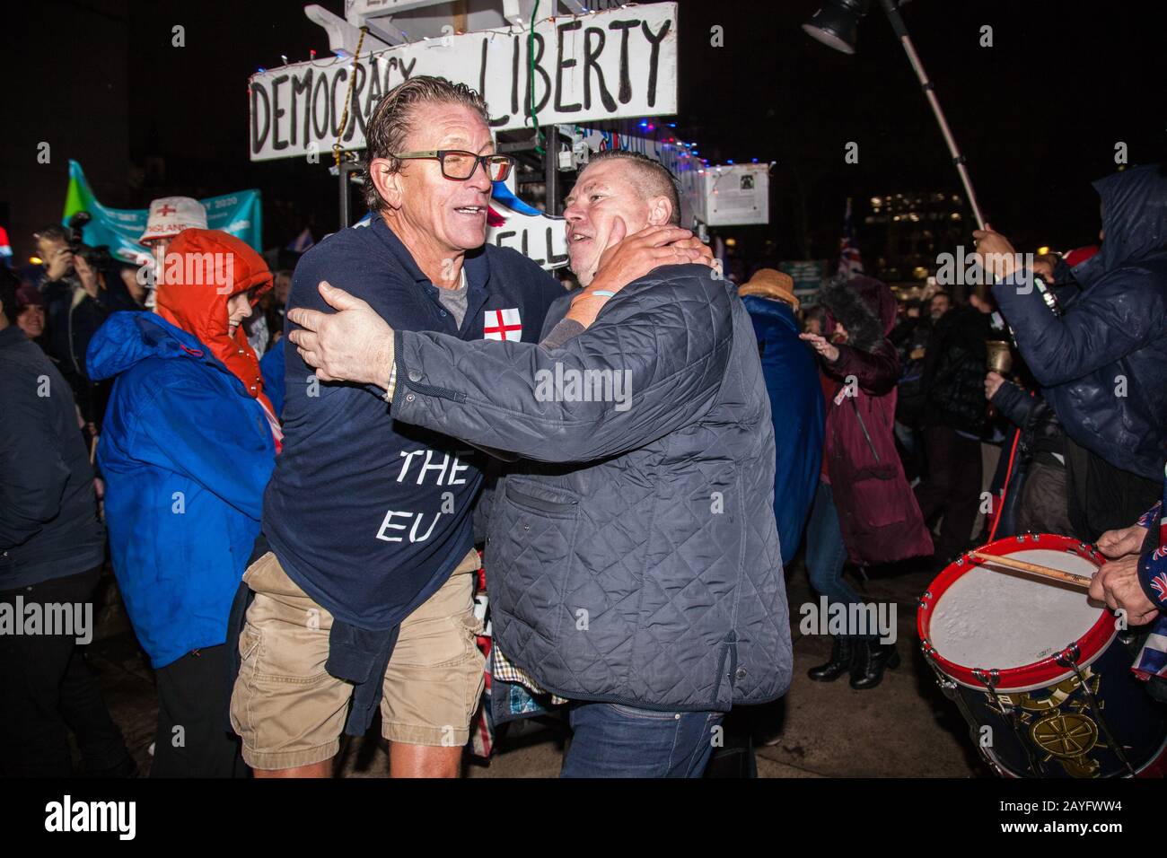 London, UK. 31st Jan 2020 Two men embracing at the Brexit celebration ...
