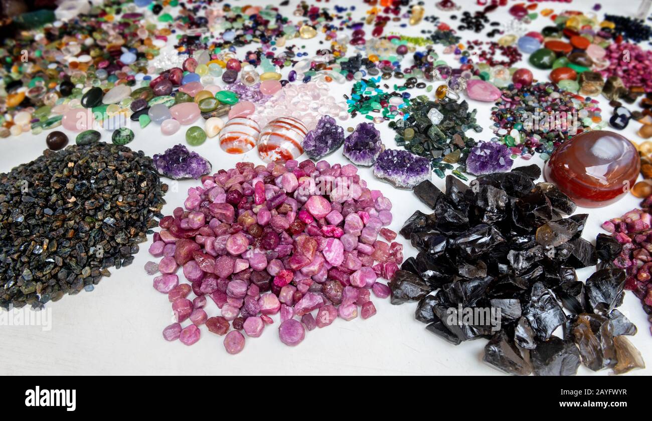 Mix shape and colorful mineral gemstones in jewelry market with outdoor ...