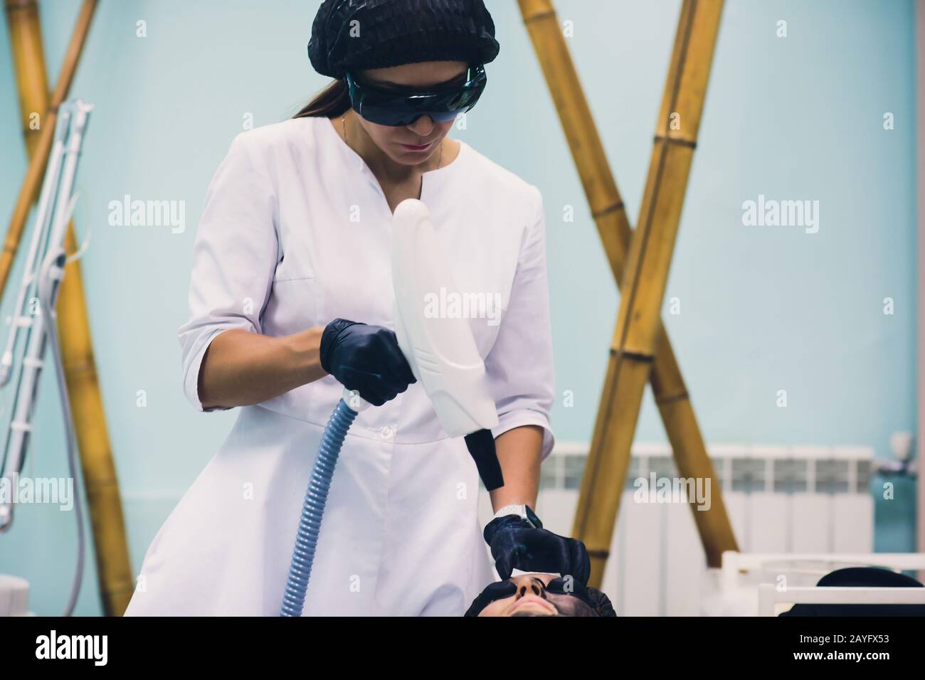 Woman in black mask on procedure carbon laser peeling Stock Photo - Alamy