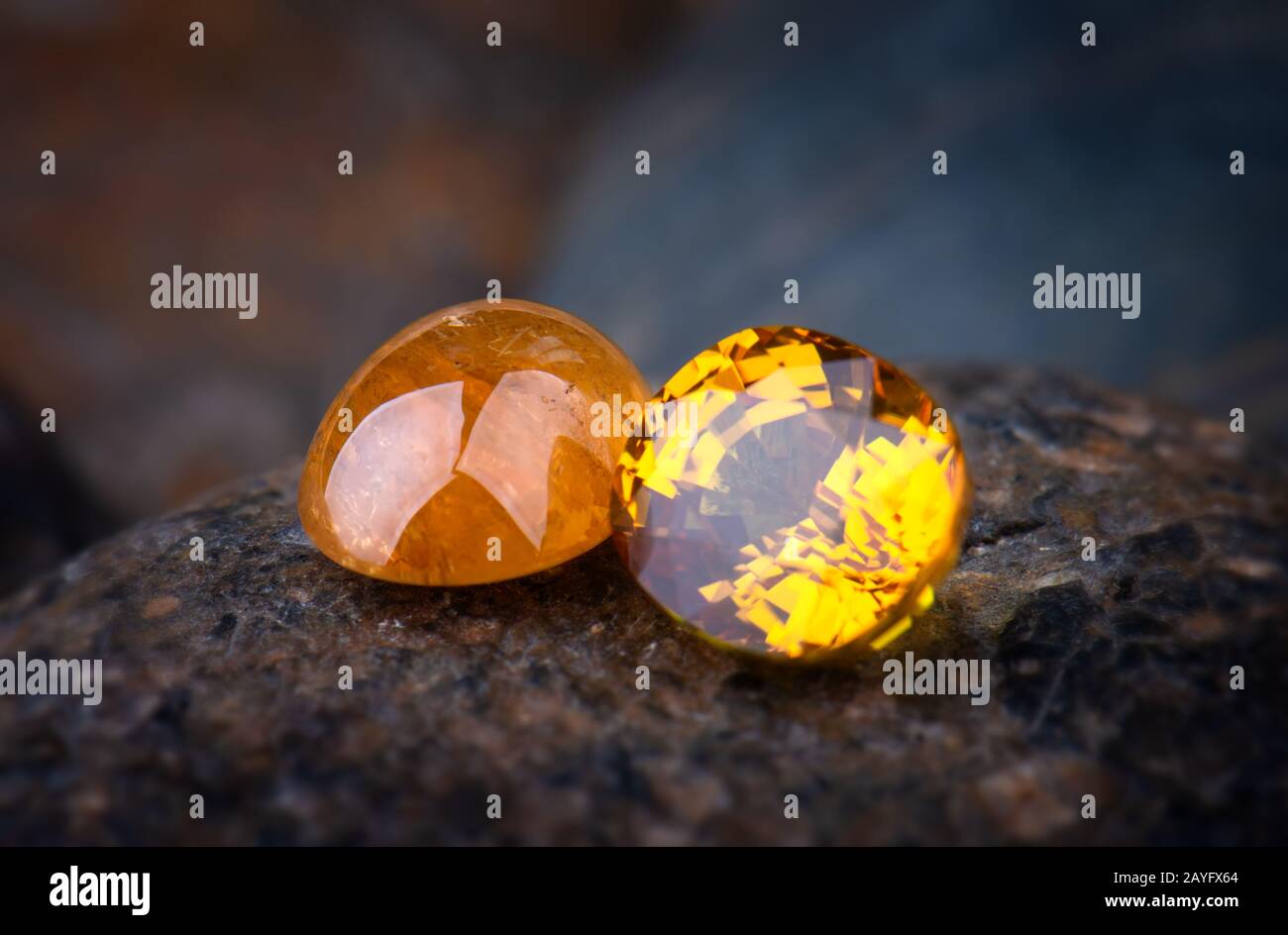 Round cut yellow mineral gemstones with stone background Stock Photo ...
