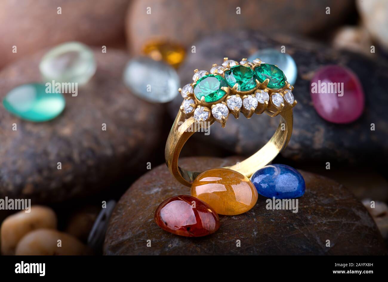 Jewelry ring and round cut mineral gemstones with dark stones ...