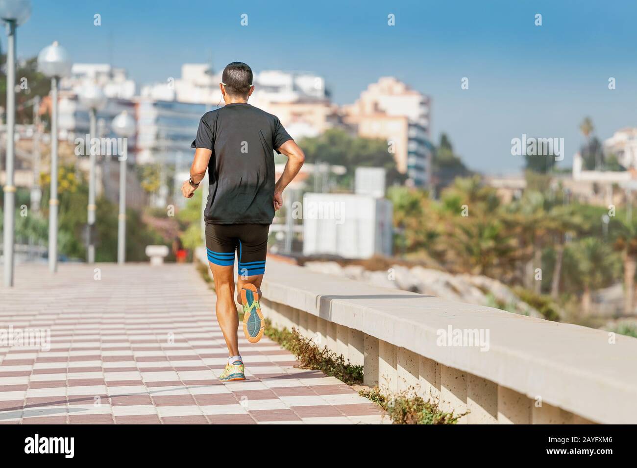 Woman trail running at coast hi-res stock photography and images - Alamy
