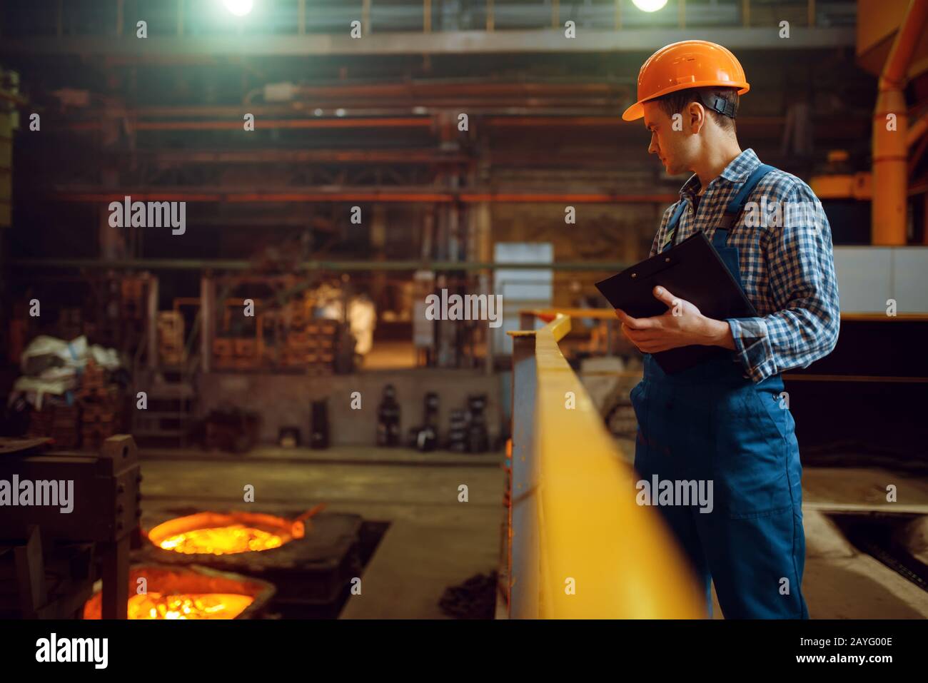 Steelmaker controls steelmaking process on factory Stock Photo - Alamy