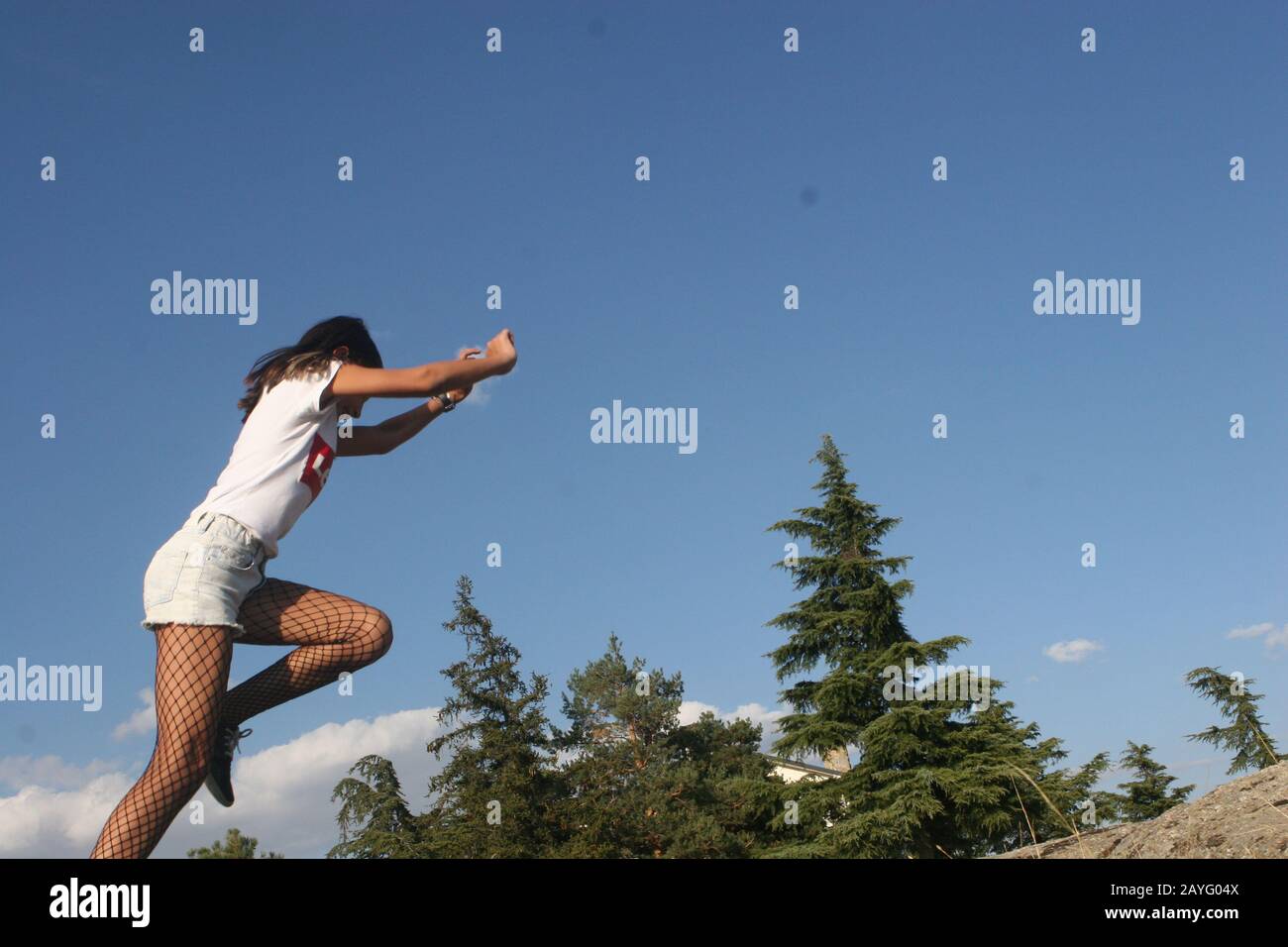 Black kid jumping hi-res stock photography and images - Alamy