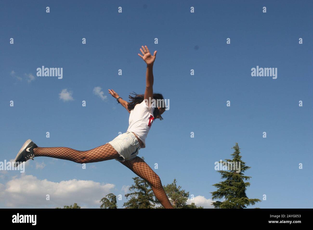 Black kid jumping hi-res stock photography and images - Alamy