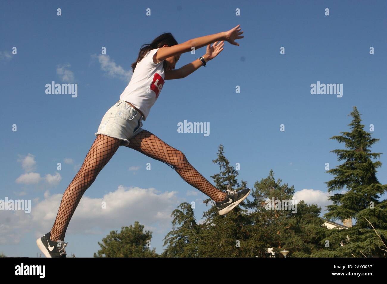 Black kid jumping hi-res stock photography and images - Alamy
