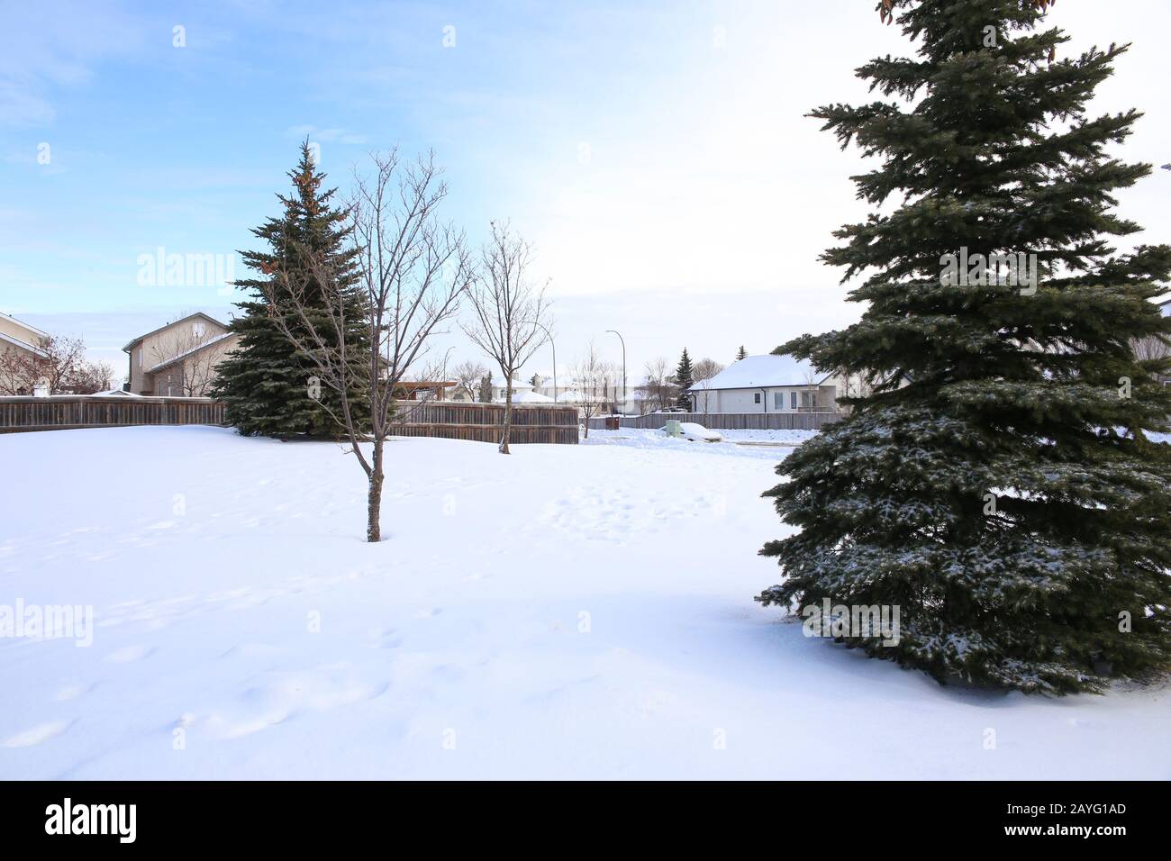 A Perfect Neighborhood Along a Frozen River in Canada Stock Photo - Alamy