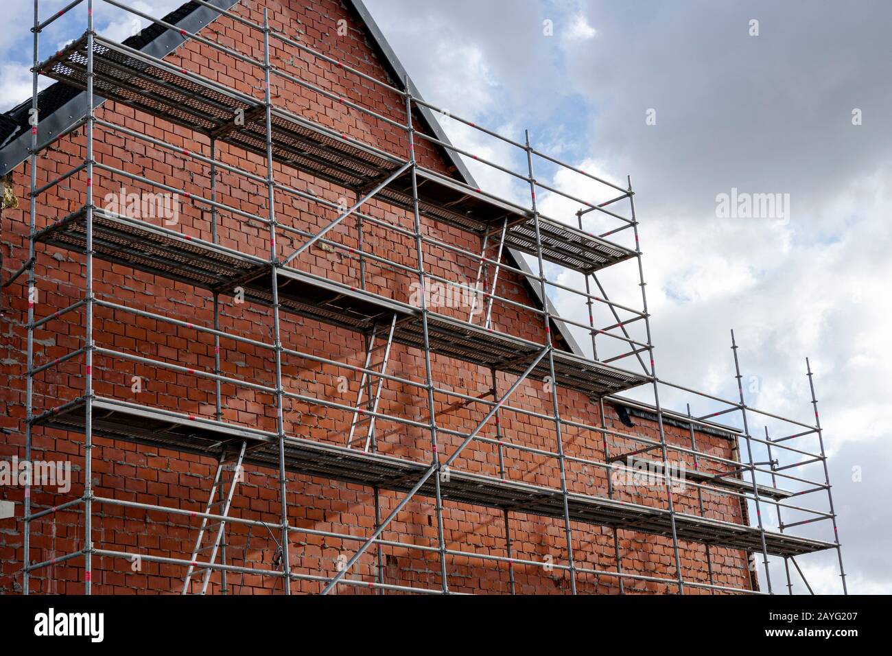 Big scaffolding on the facade of a house to renovate and insulate the ...
