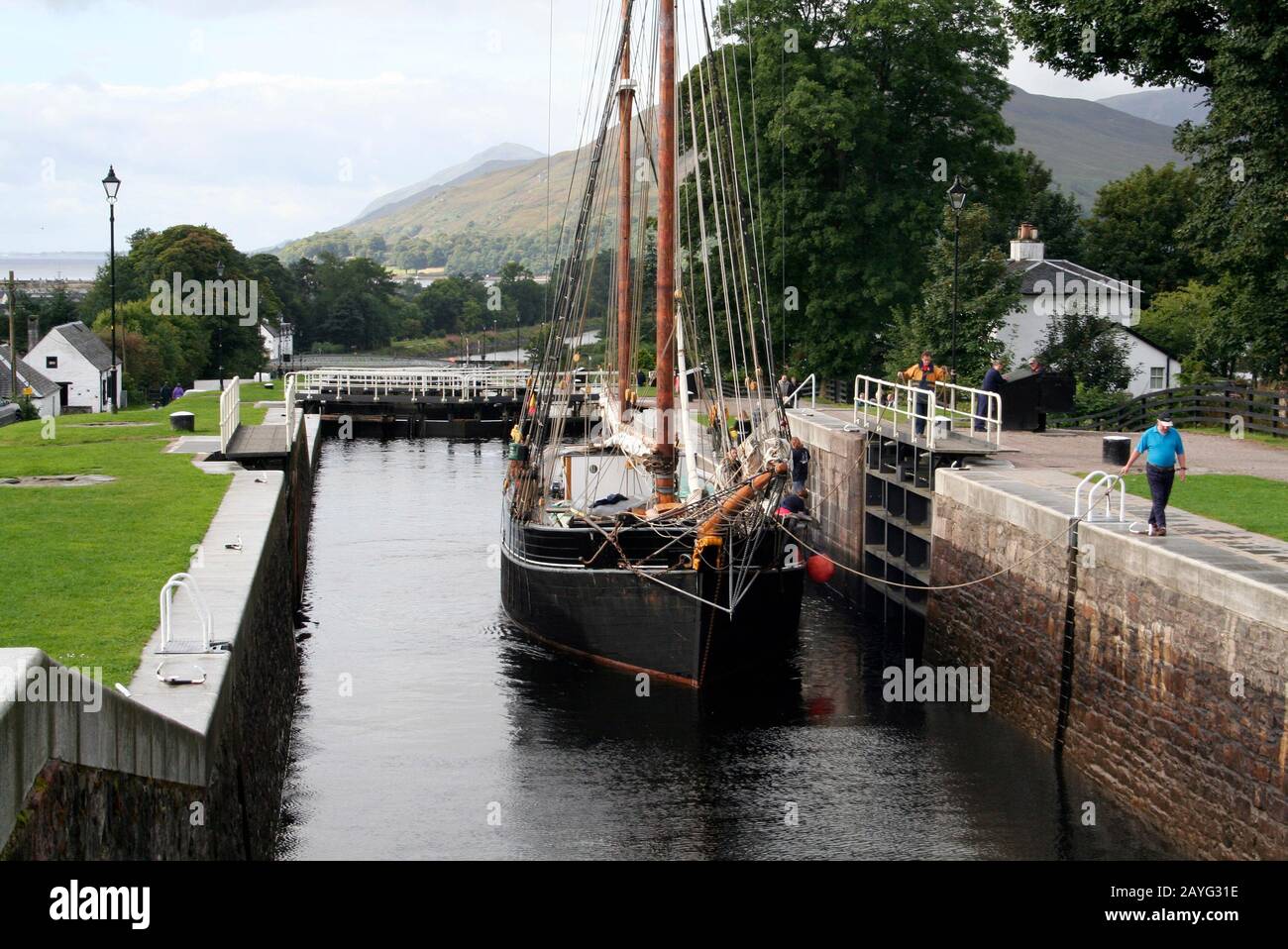 Old wooden sailing vessel in lock near the top of Neptune's staircase ...