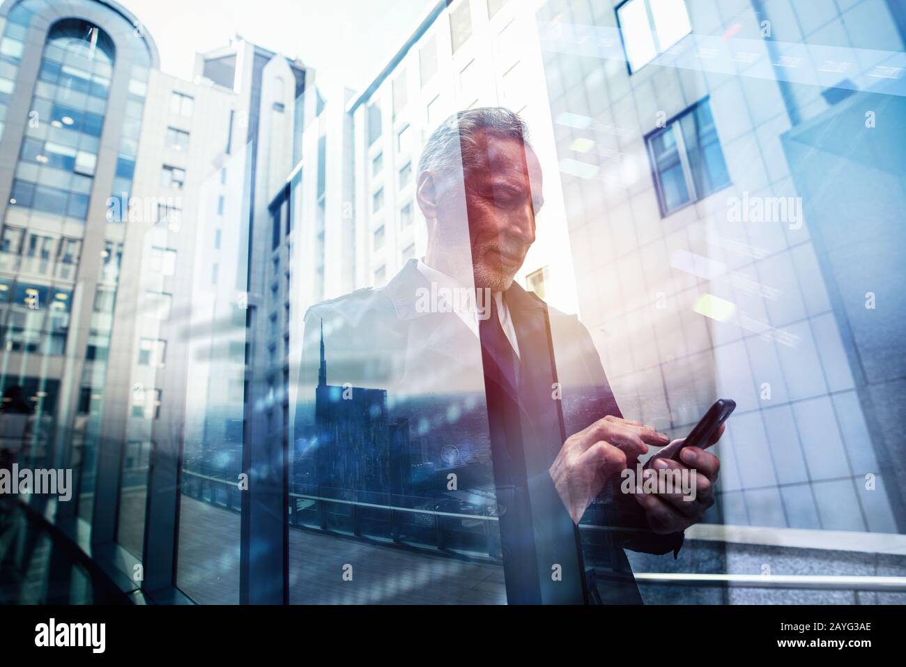 Senior businessman uses mobile phone to organize appointments. Double ...