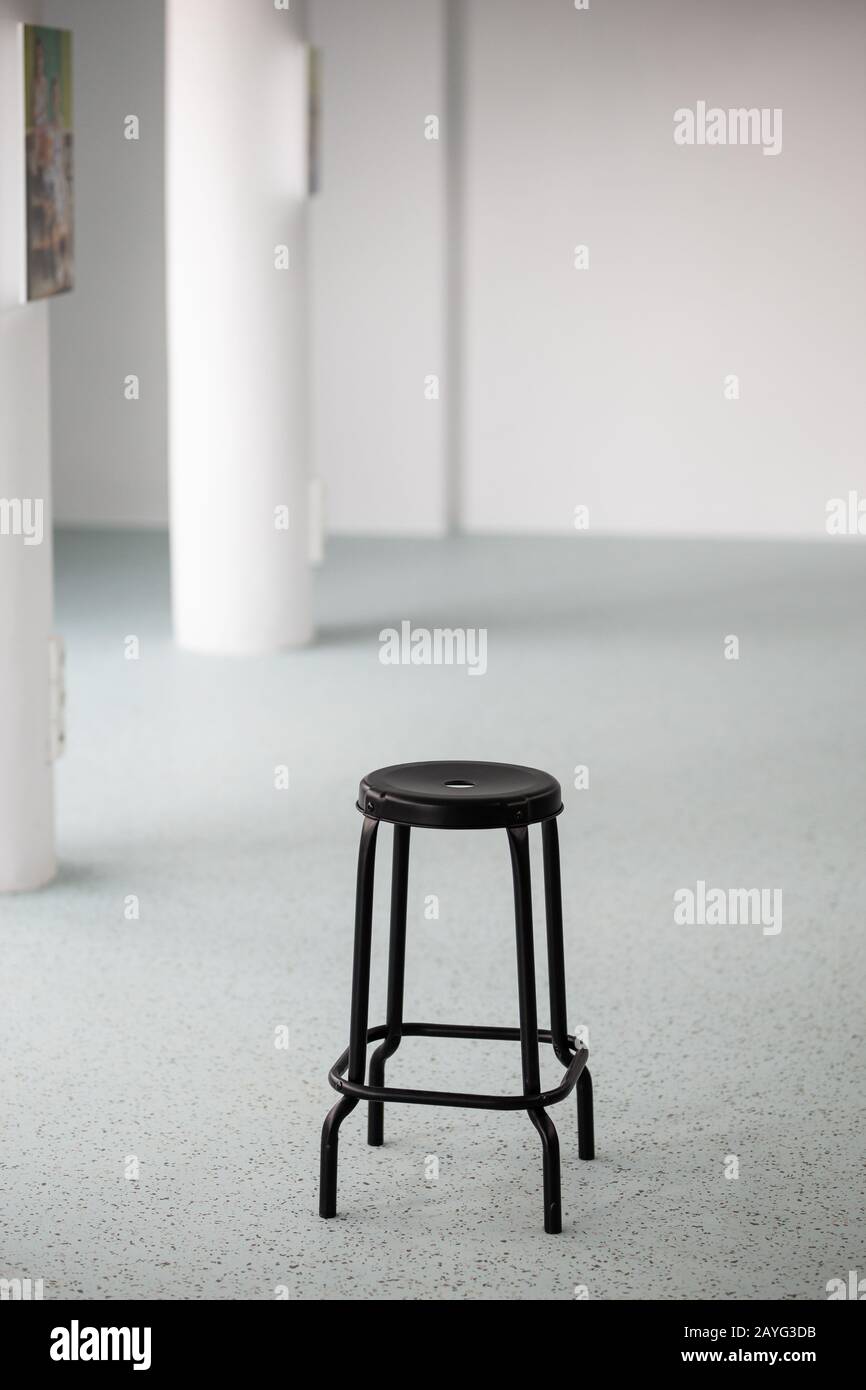 black bar stool in empty room Stock Photo - Alamy