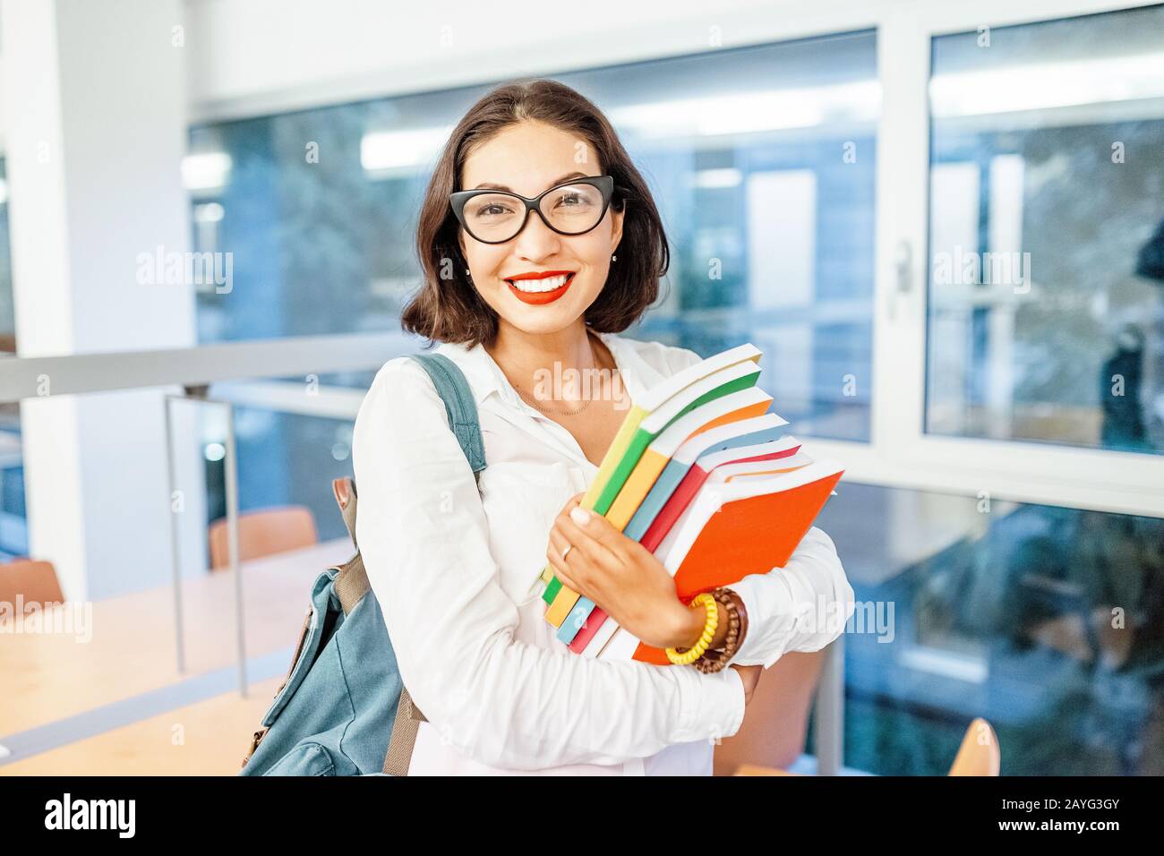Teacher Carrying Books High Resolution Stock Photography and Images - Alamy