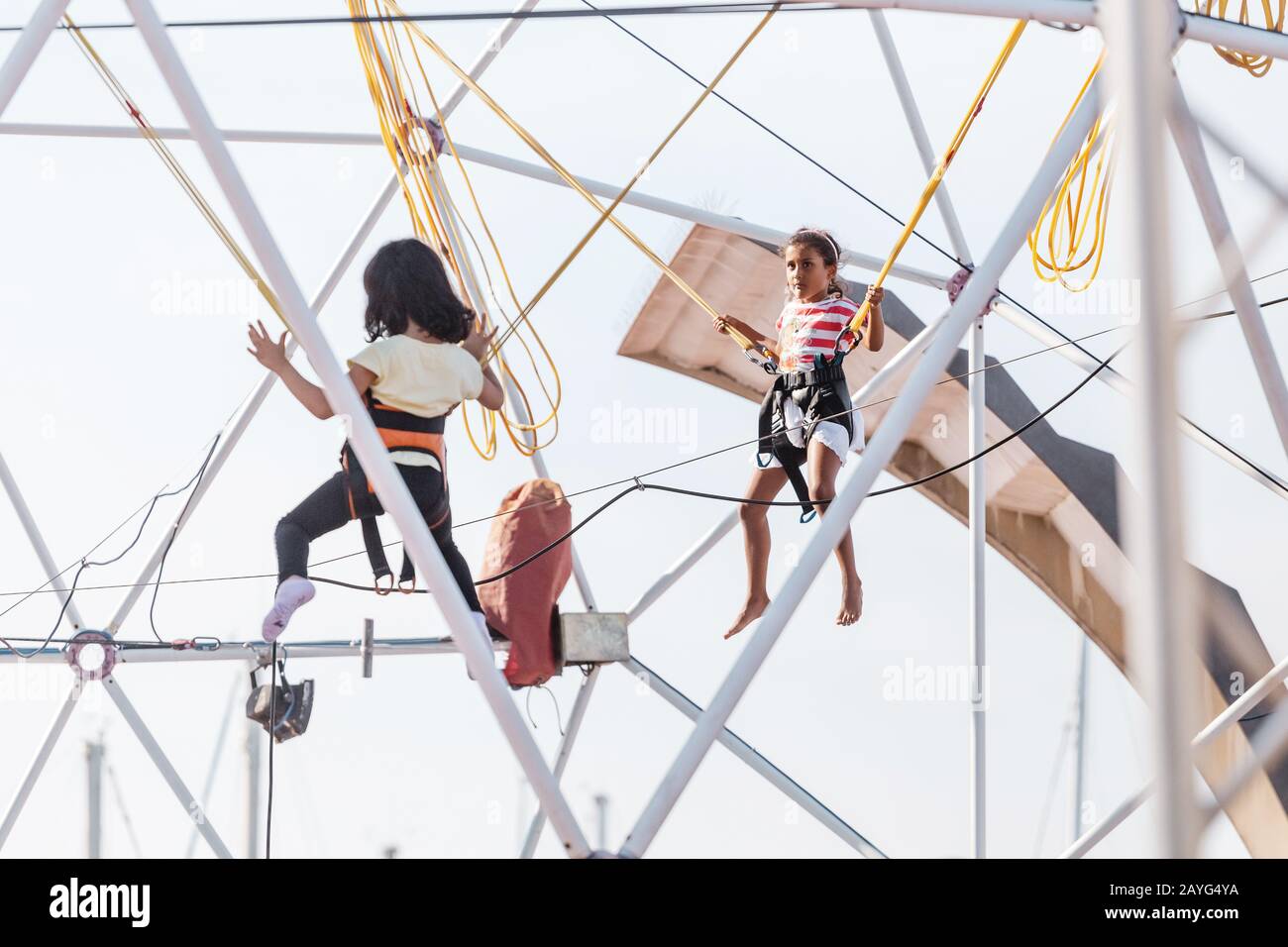 29 JULY 2018, BARCELONA, SPAIN: Young kid jumping with rope on ...