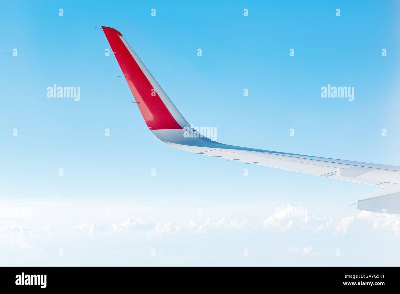 Modern wing of jet plane during flight Stock Photo - Alamy