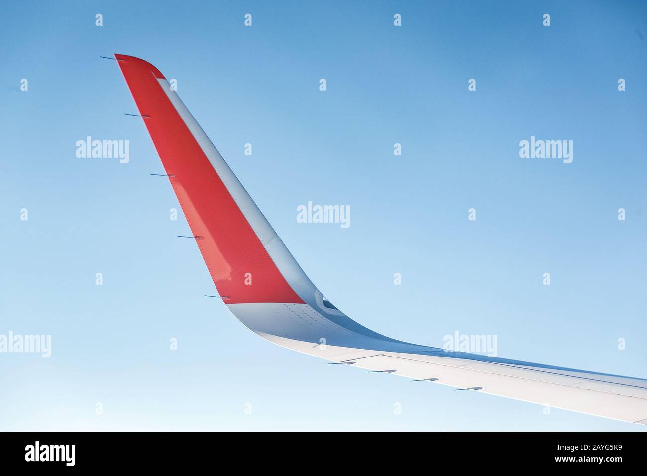 Modern wing of jet plane during flight Stock Photo - Alamy