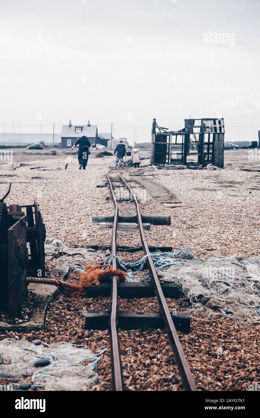 Person walking on the bleak beach of Dungeness Stock Photo - Alamy
