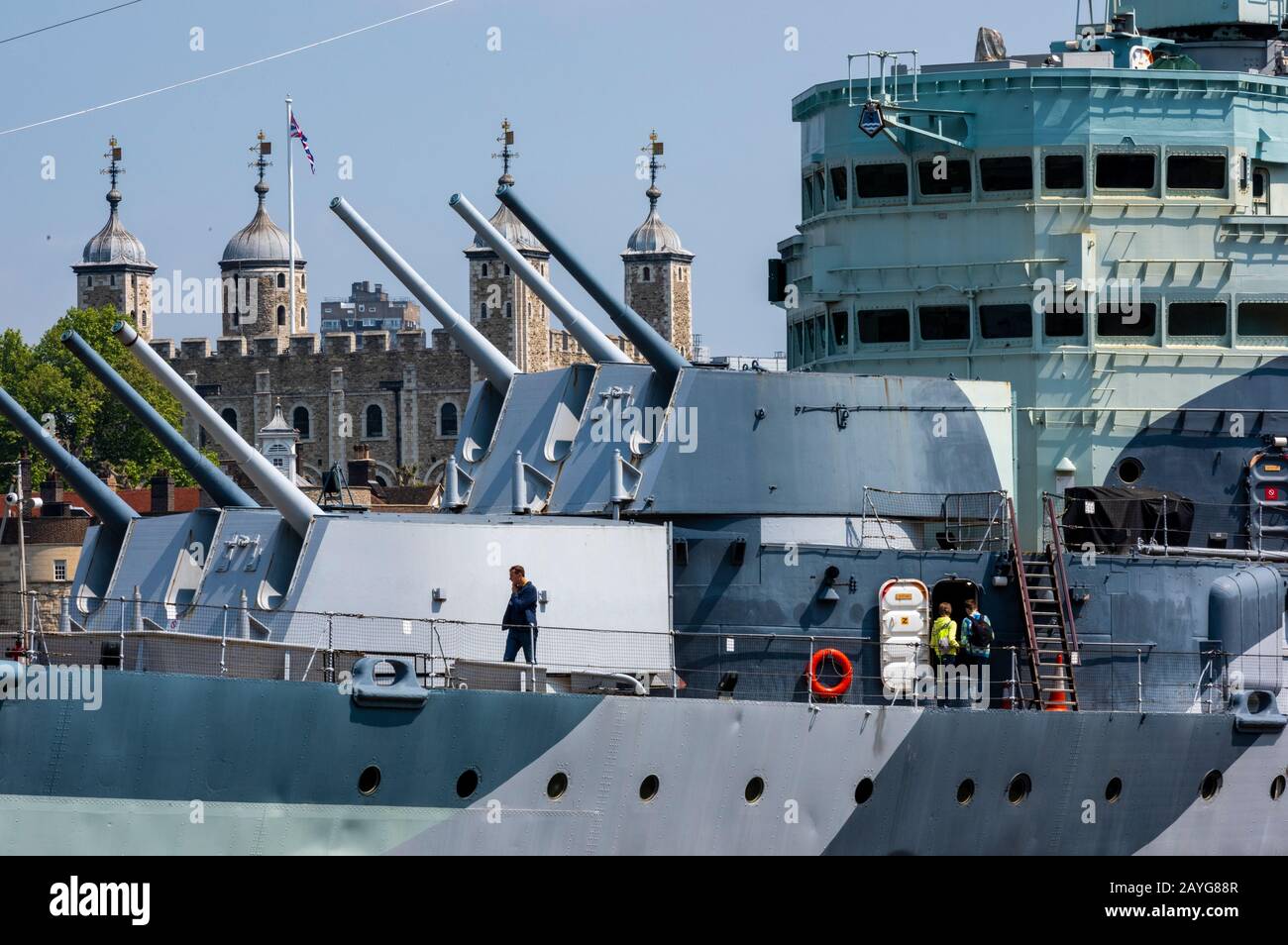 hms belfast and the tower of london next to the river thames in the ...