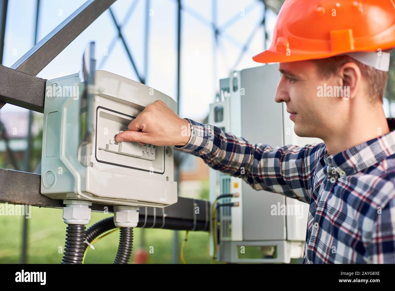 Close up of hand man engineer pushing button at the electrical ...