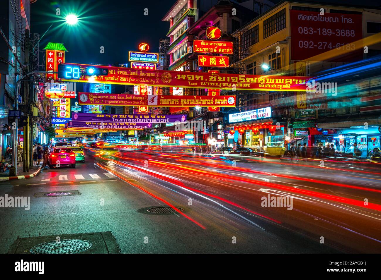 BANGKOK - MARCH 03: Busy Yaowarat Road in the evening on March 03, 2013 in Bangkok. Yaowarat ...