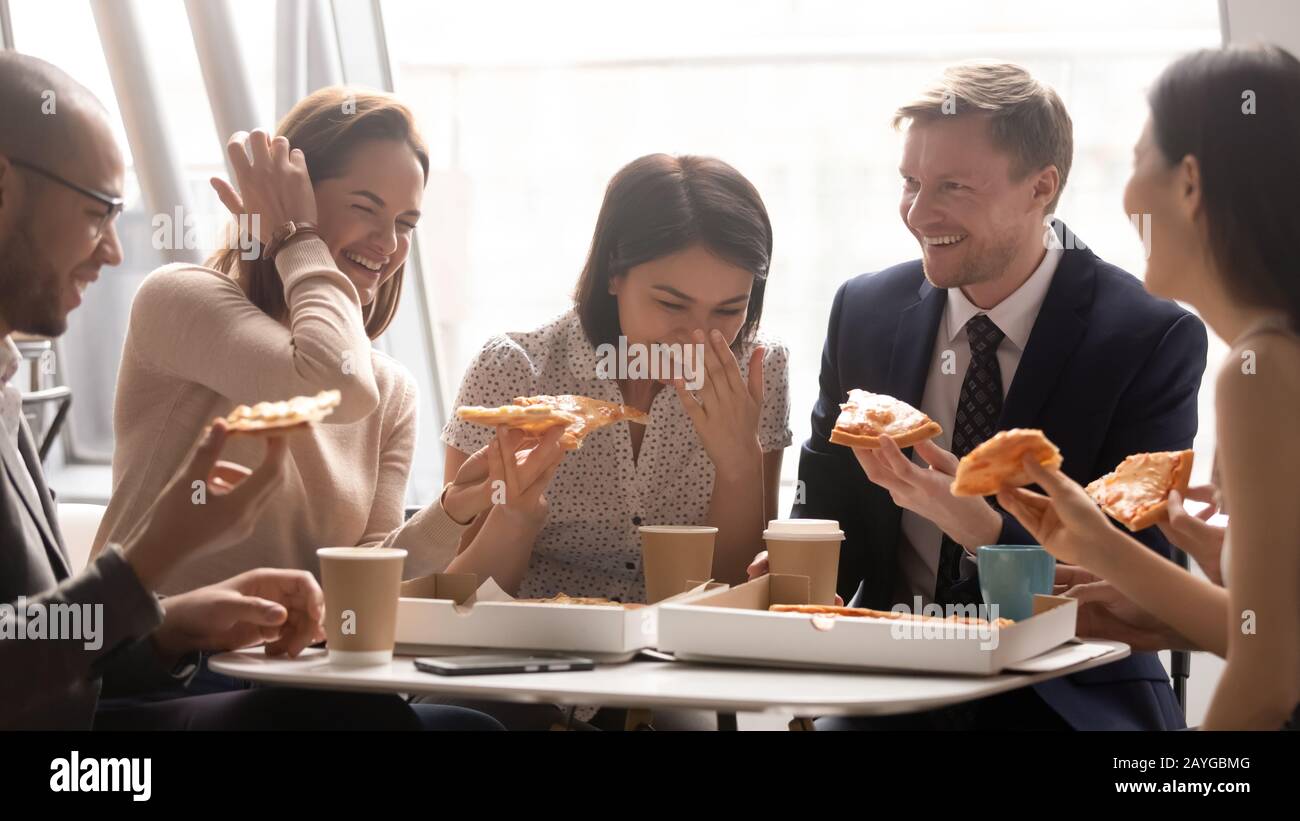 Colleagues having lunch together office hi-res stock photography and ...
