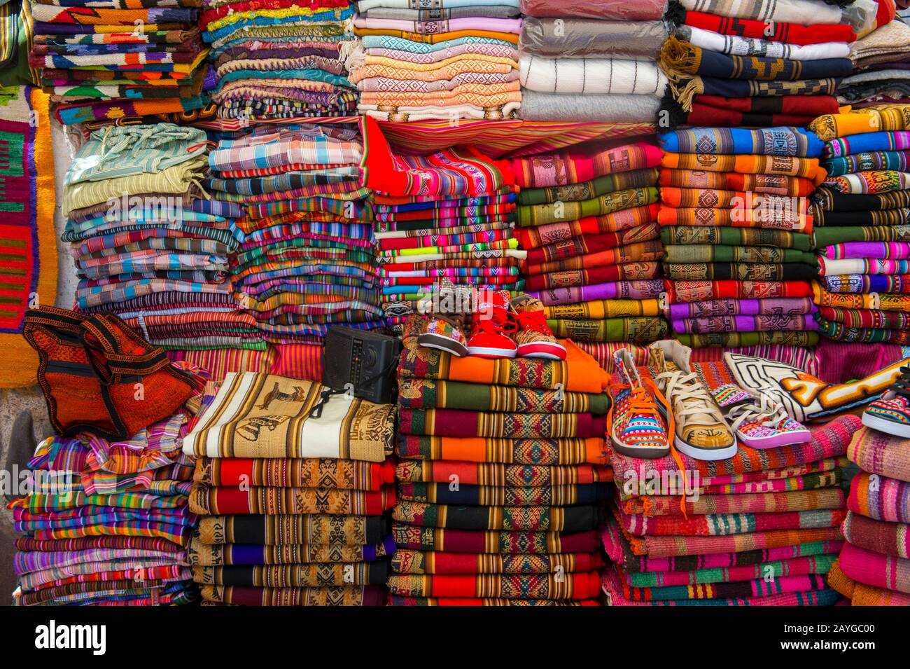 Street scene with colorful woven fabrics for sale in Humahuaca, a city ...