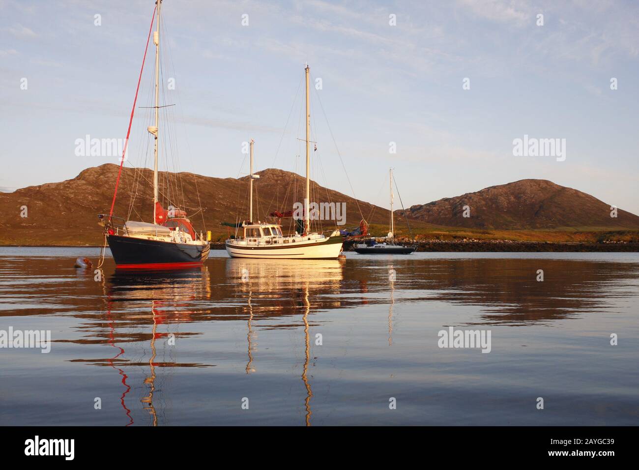 Sailing yachts on visitors' moorings by the ferry pier Lochmaddy, North ...