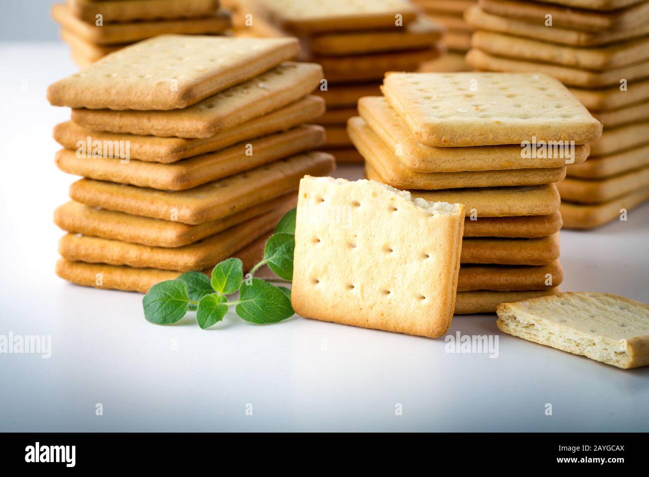 bunch of salty crackers stacked in to the pillars Stock Photo - Alamy