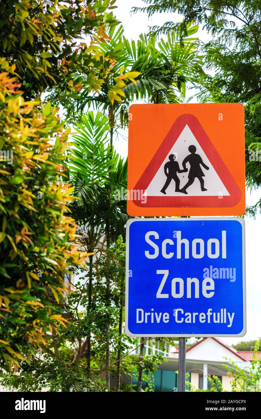 yellow color warning school zone traffic sign Stock Photo - Alamy