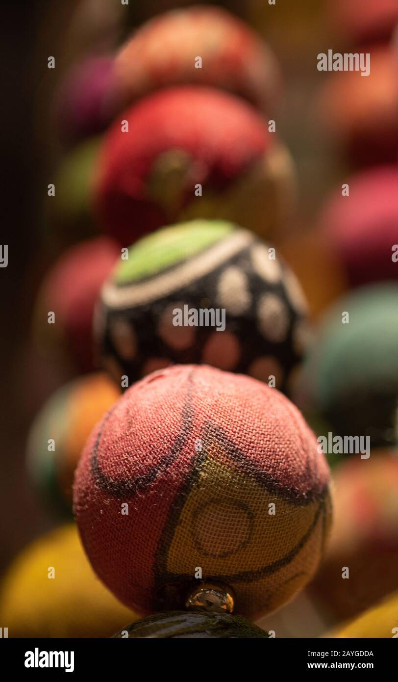 Colourful collection of connected cloth balls Stock Photo - Alamy